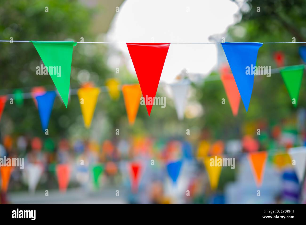 Decorative multi-colored triangle flags against the background at the ...
