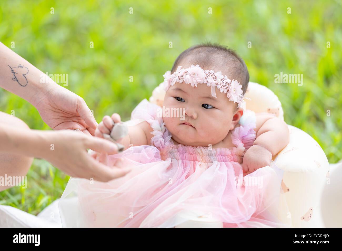 A Taiwanese couple in their 20s and their 7-month-old baby celebrate ...