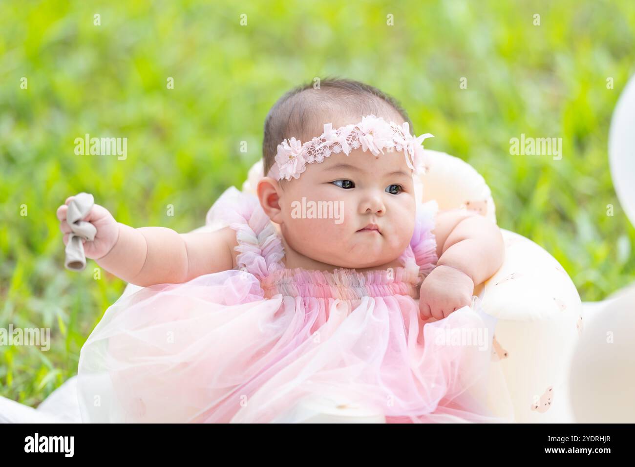 A Taiwanese couple in their 20s and their 7-month-old baby celebrate ...