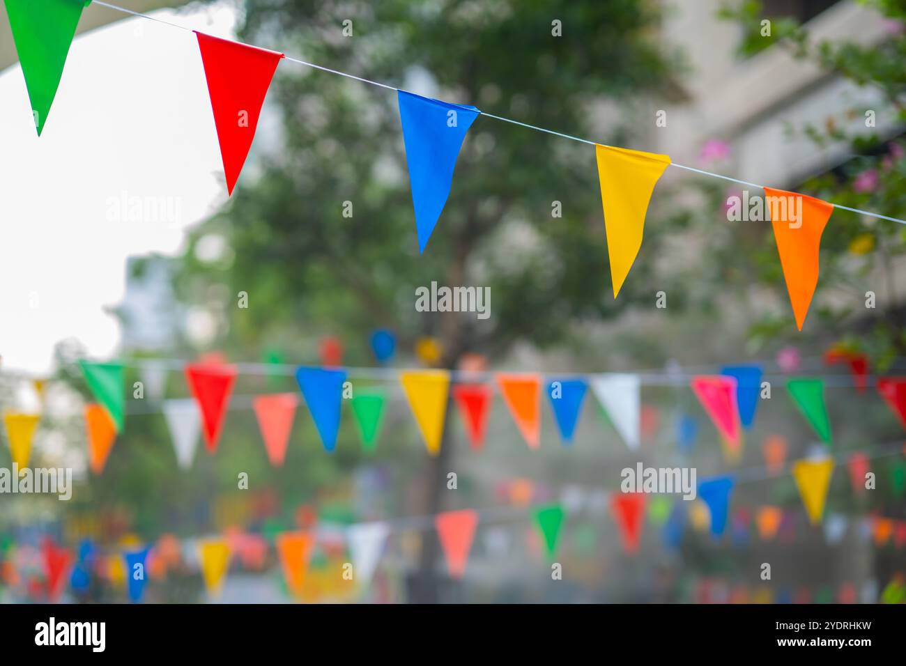 Decorative multi-colored triangle flags against the background at the ...