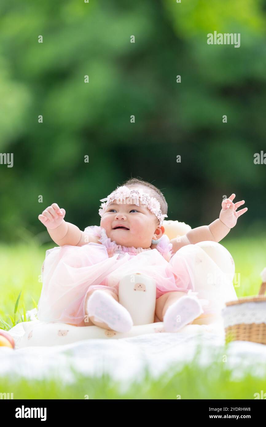 A Taiwanese couple in their 20s and their 7-month-old baby celebrate ...