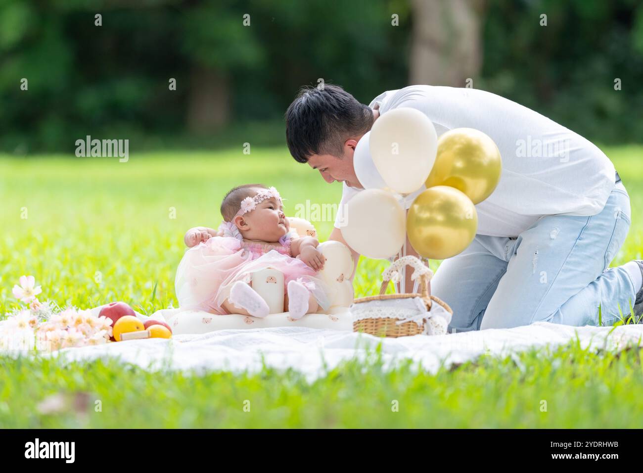 A Taiwanese couple in their 20s and their 7-month-old baby celebrate a ...