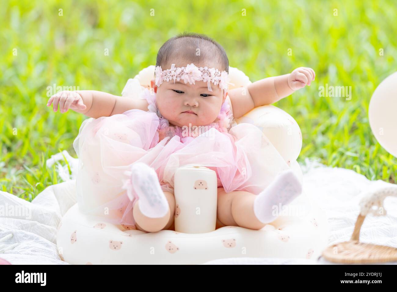 A Taiwanese couple in their 20s and their 7-month-old baby celebrate ...