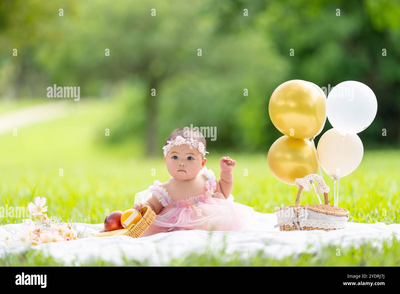 A Taiwanese couple in their 20s and their 7-month-old baby celebrate ...
