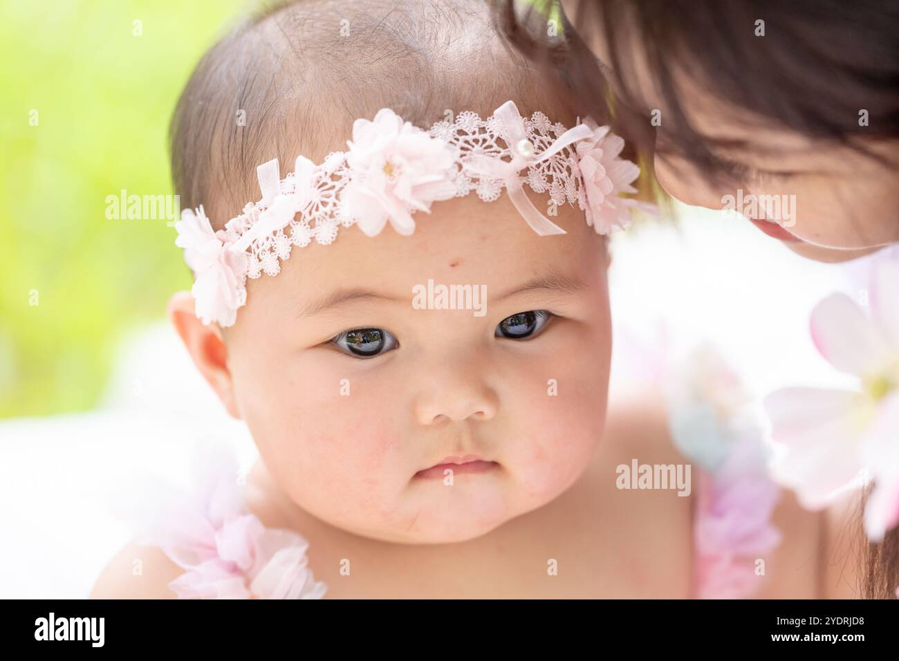 A Taiwanese couple in their 20s and their 7-month-old baby celebrate a ...