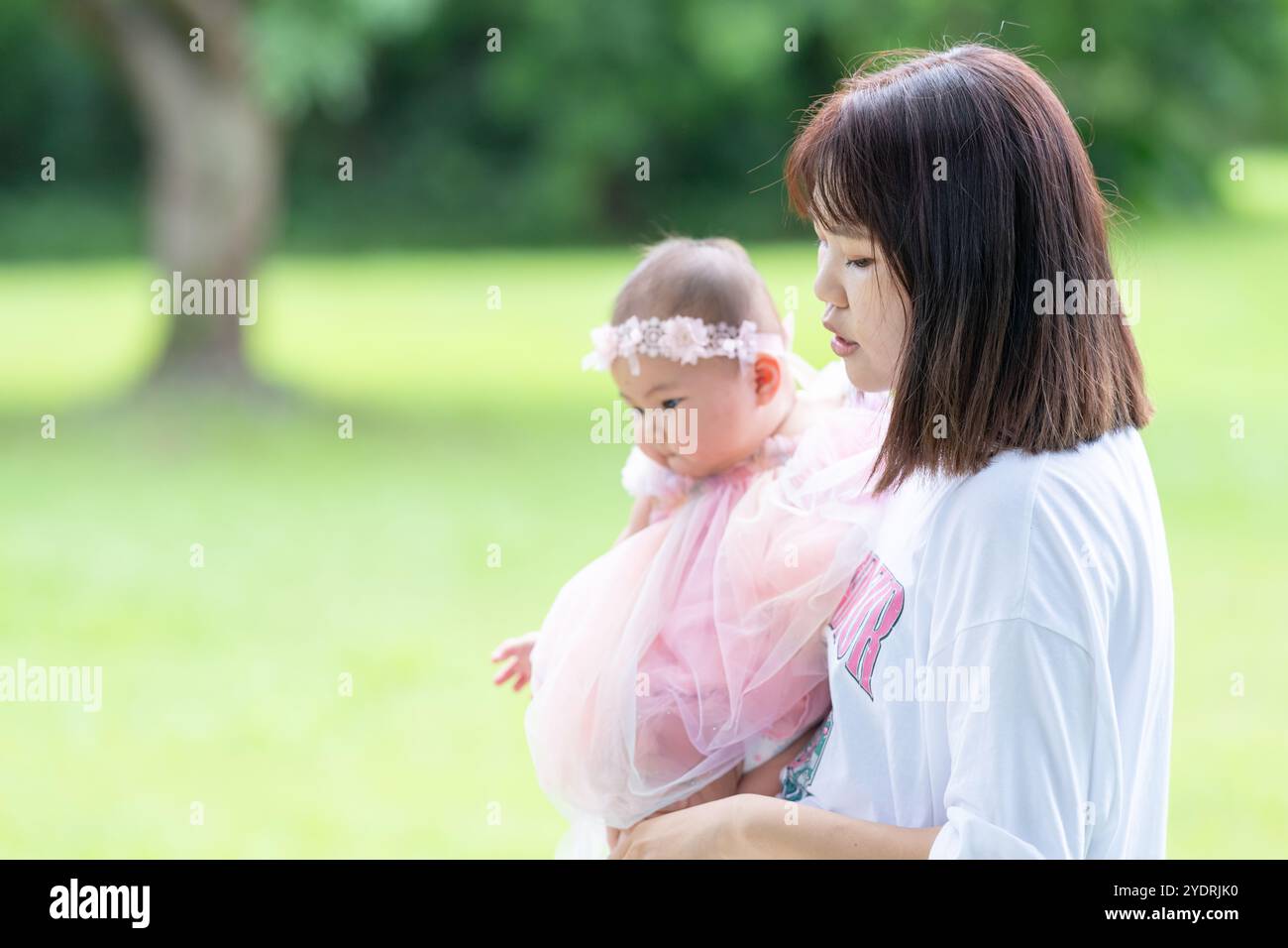 A Taiwanese couple in their 20s and their 7-month-old baby celebrate a ...