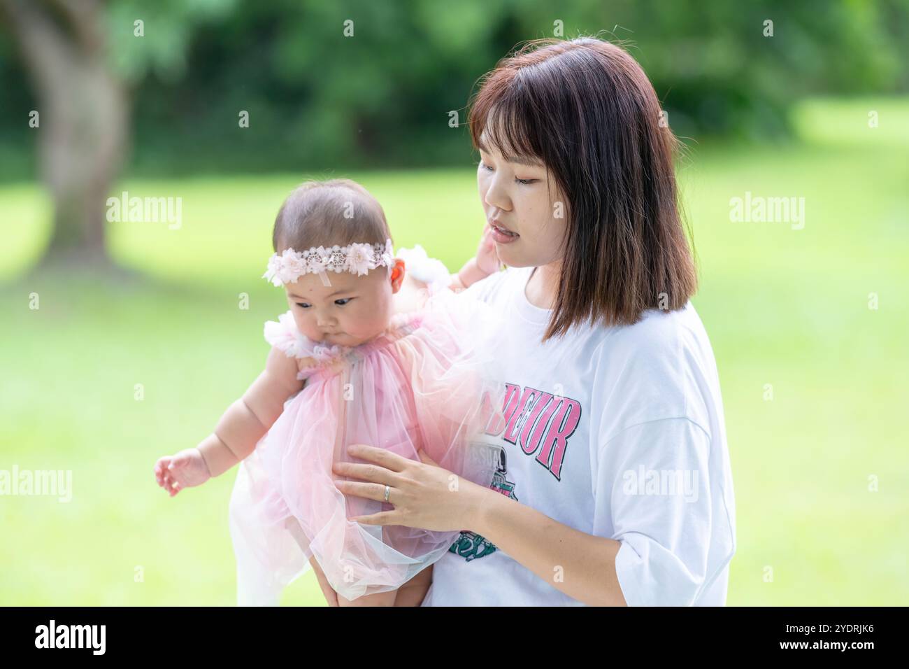 A Taiwanese couple in their 20s and their 7-month-old baby celebrate a ...