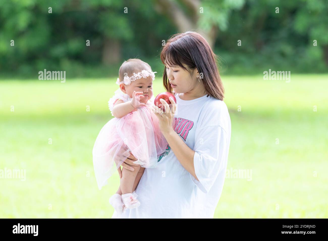 A Taiwanese couple in their 20s and their 7-month-old baby celebrate a ...