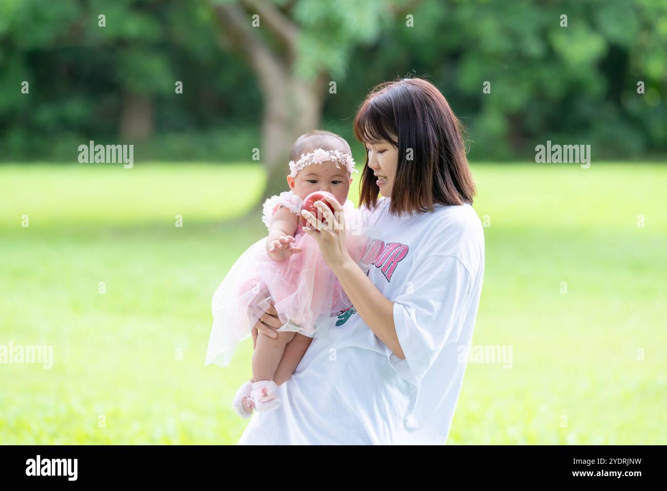 A Taiwanese couple in their 20s and their 7-month-old baby celebrate a ...