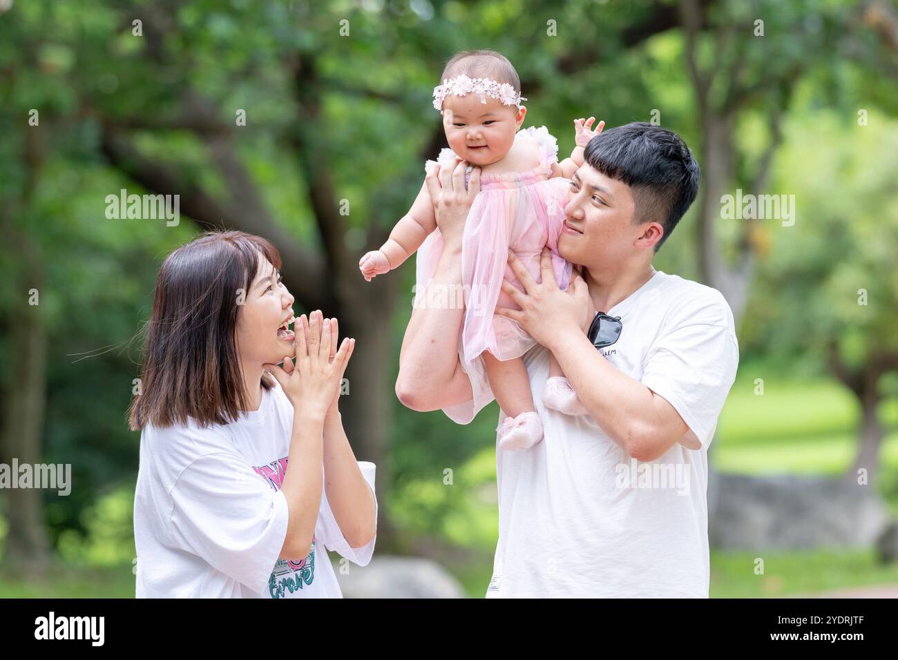 A Taiwanese couple in their 20s and their 7-month-old baby celebrate a ...