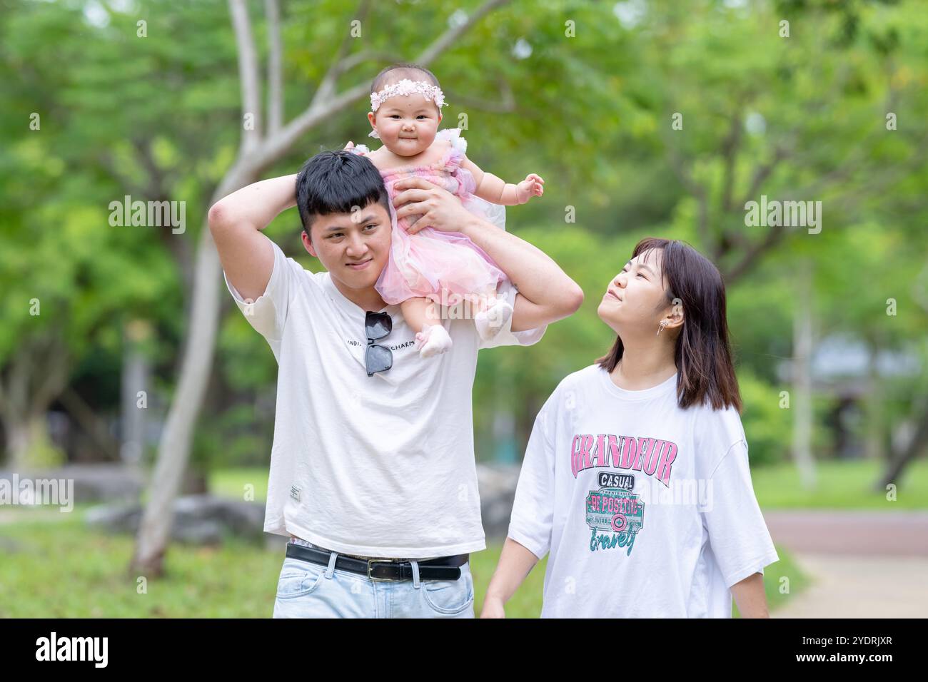 A Taiwanese couple in their 20s and their 7-month-old baby celebrate a ...