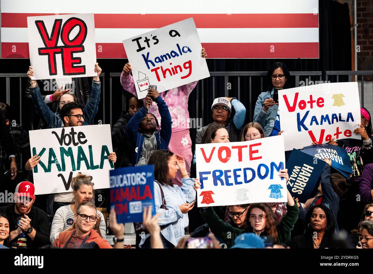 People holding up signs at a Kamala Harris campaign rally at the The ...