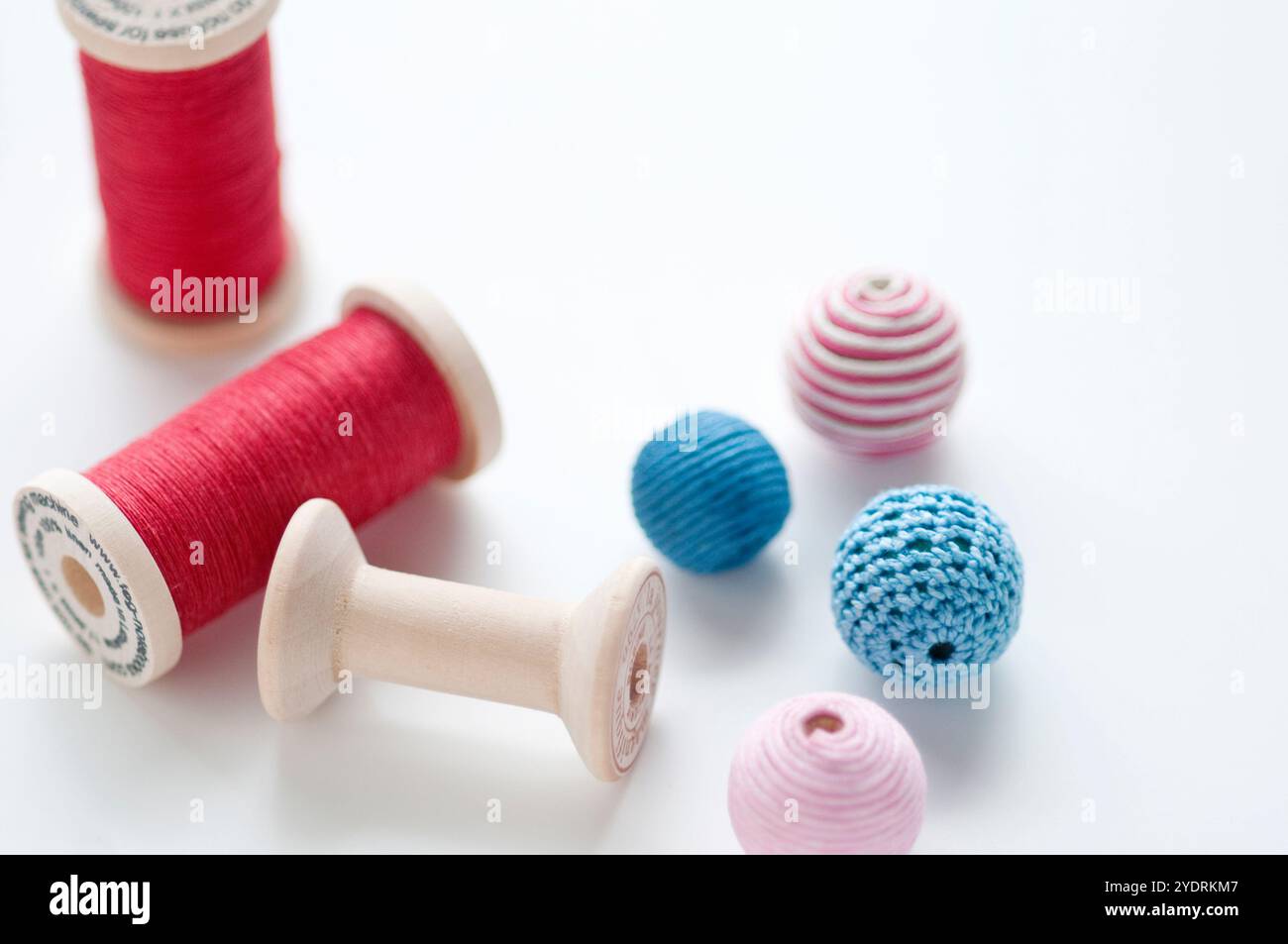 Spool of yarn and buttons Stock Photo - Alamy