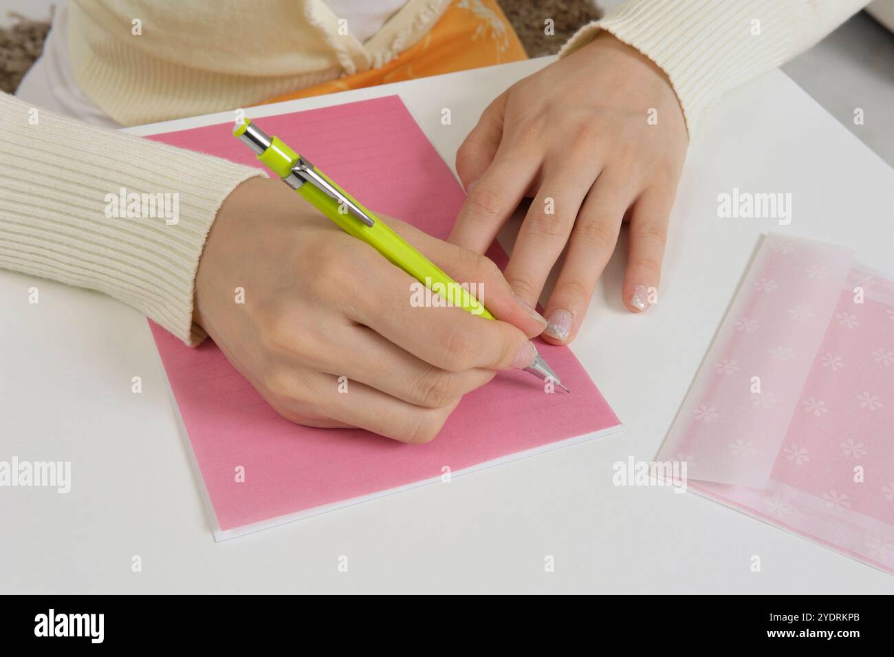 Hand of a woman writing a letter Stock Photo - Alamy