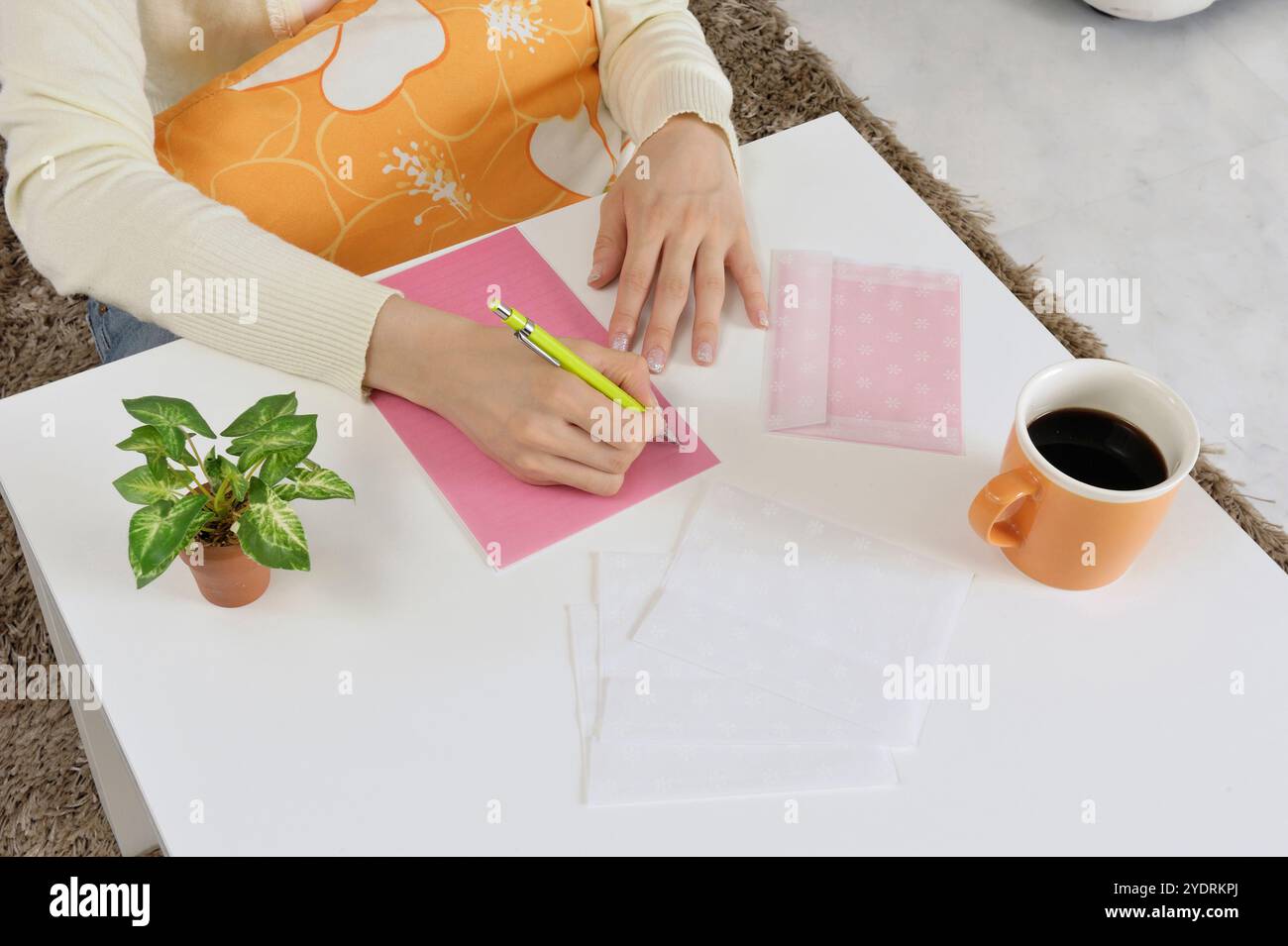 Hand of a woman writing a letter Stock Photo - Alamy