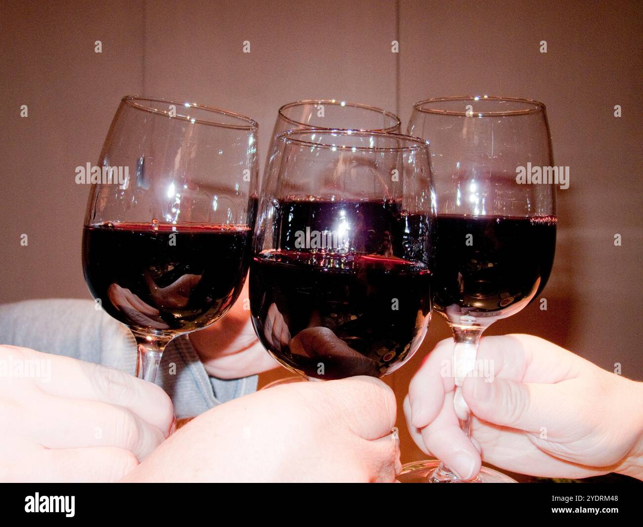 Toasting with wine Stock Photo - Alamy