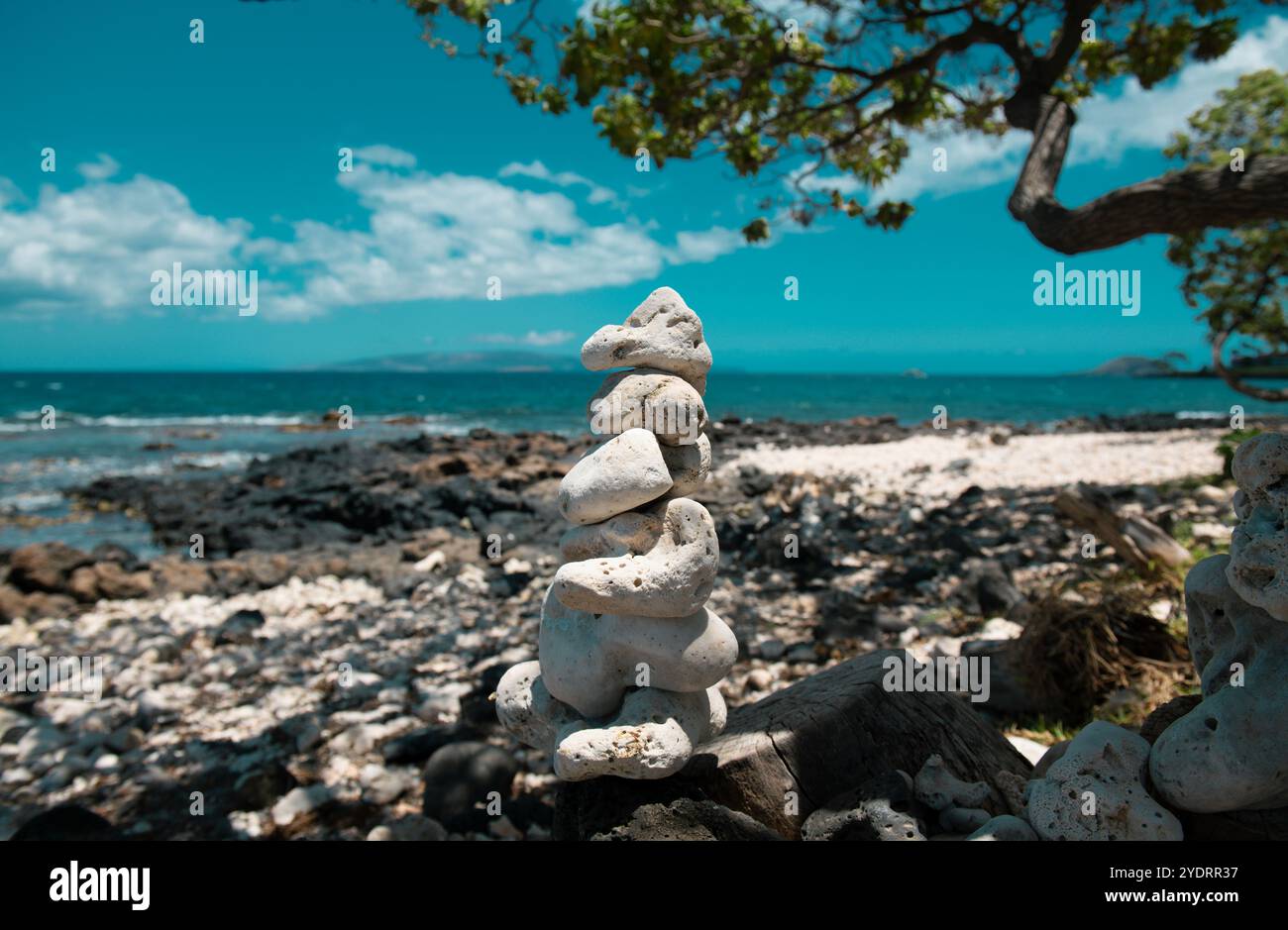 Balancing pyramid of sea pebbles on a beach background, the concept of ...