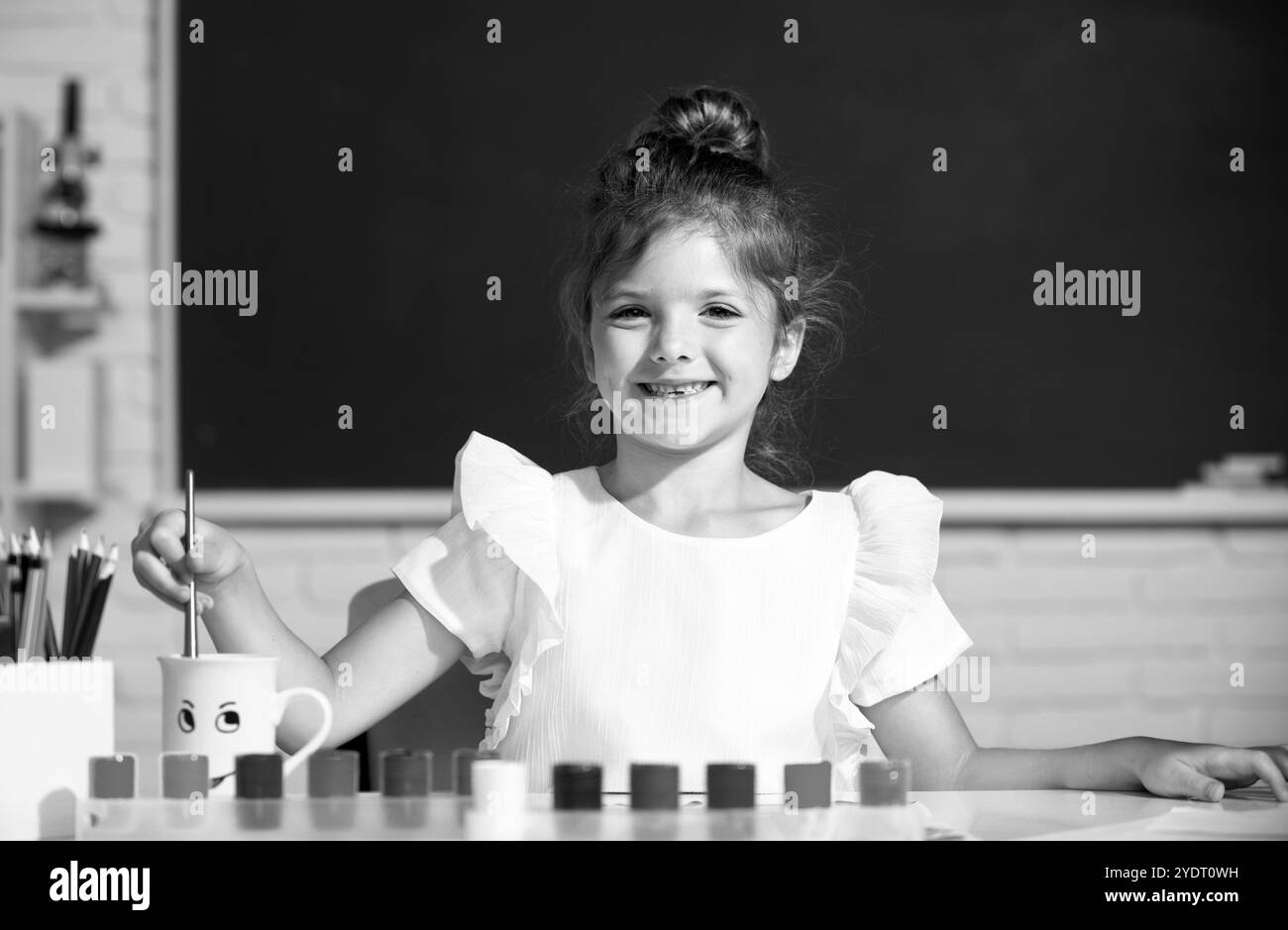 Cute little girl child painting with paints color and brush. Drawing ...