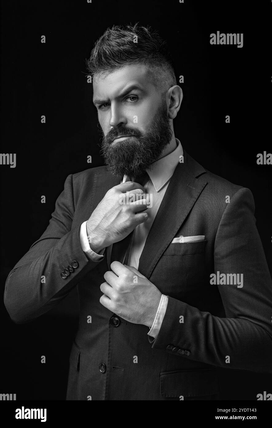 Bow-tie fashion. Bearded man in dark grey suit. Man in classic suit ...