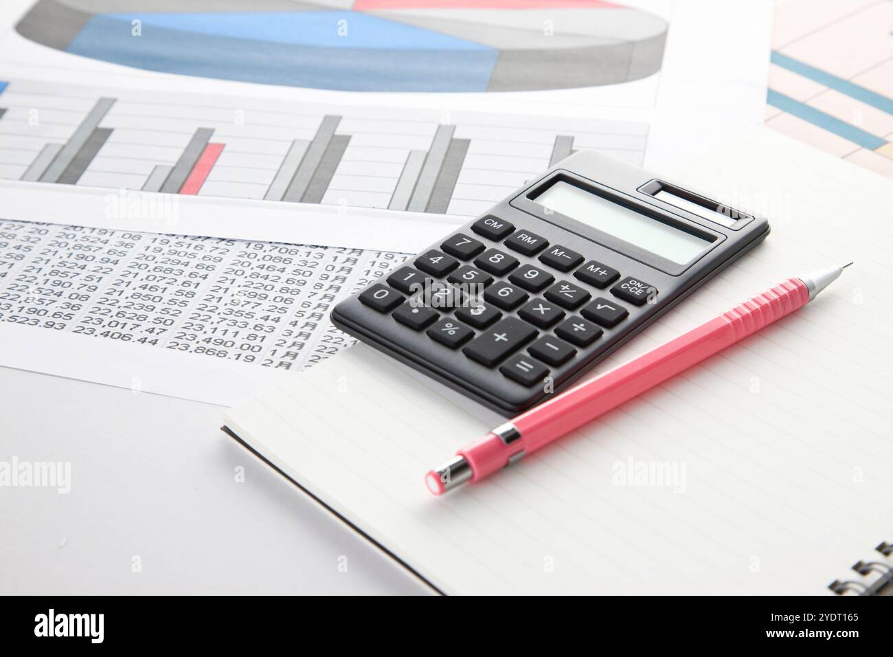 Calculator and graph Stock Photo - Alamy