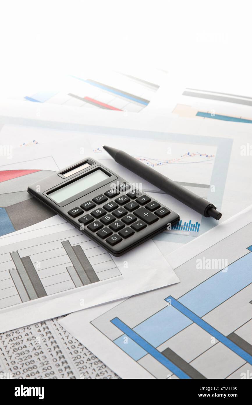 Calculator and graph Stock Photo - Alamy