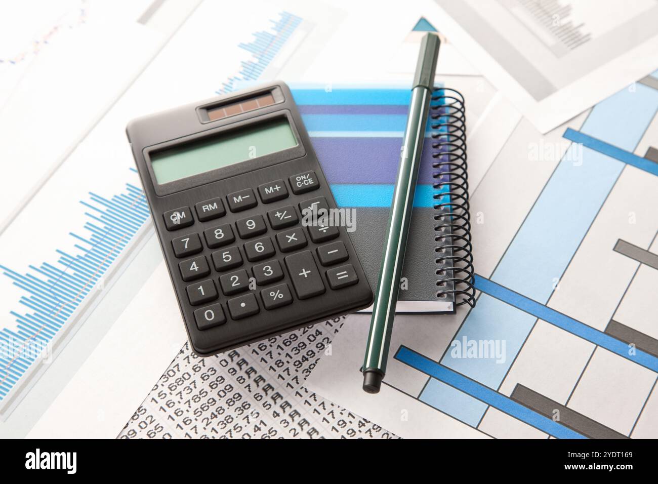Calculator and graph Stock Photo - Alamy