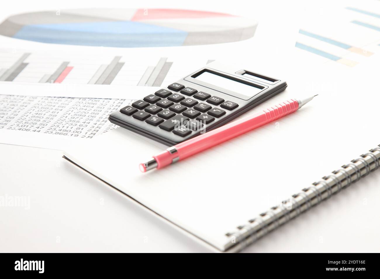 Calculator and graph Stock Photo - Alamy