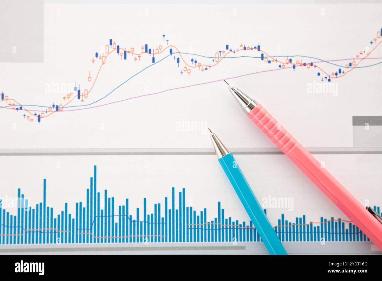 Ballpoint pen and share price graph Stock Photo - Alamy