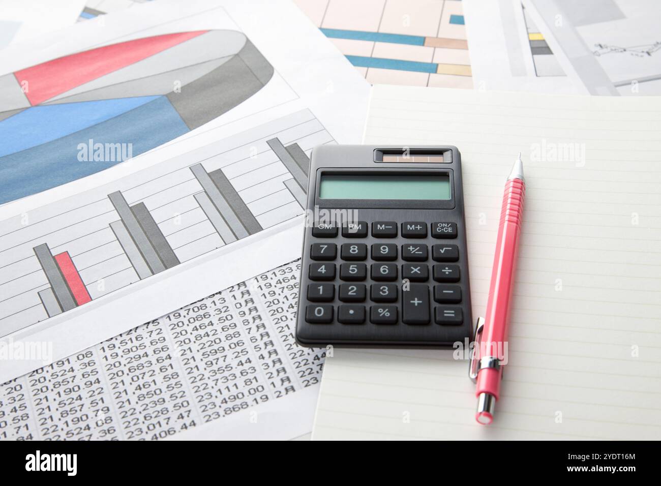 Calculator and graph Stock Photo - Alamy