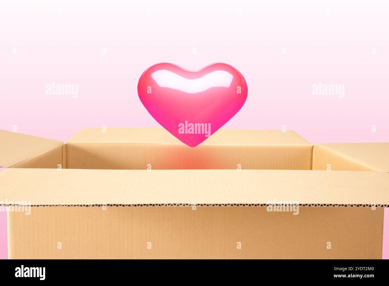 Heart popping out of cardboard Stock Photo - Alamy