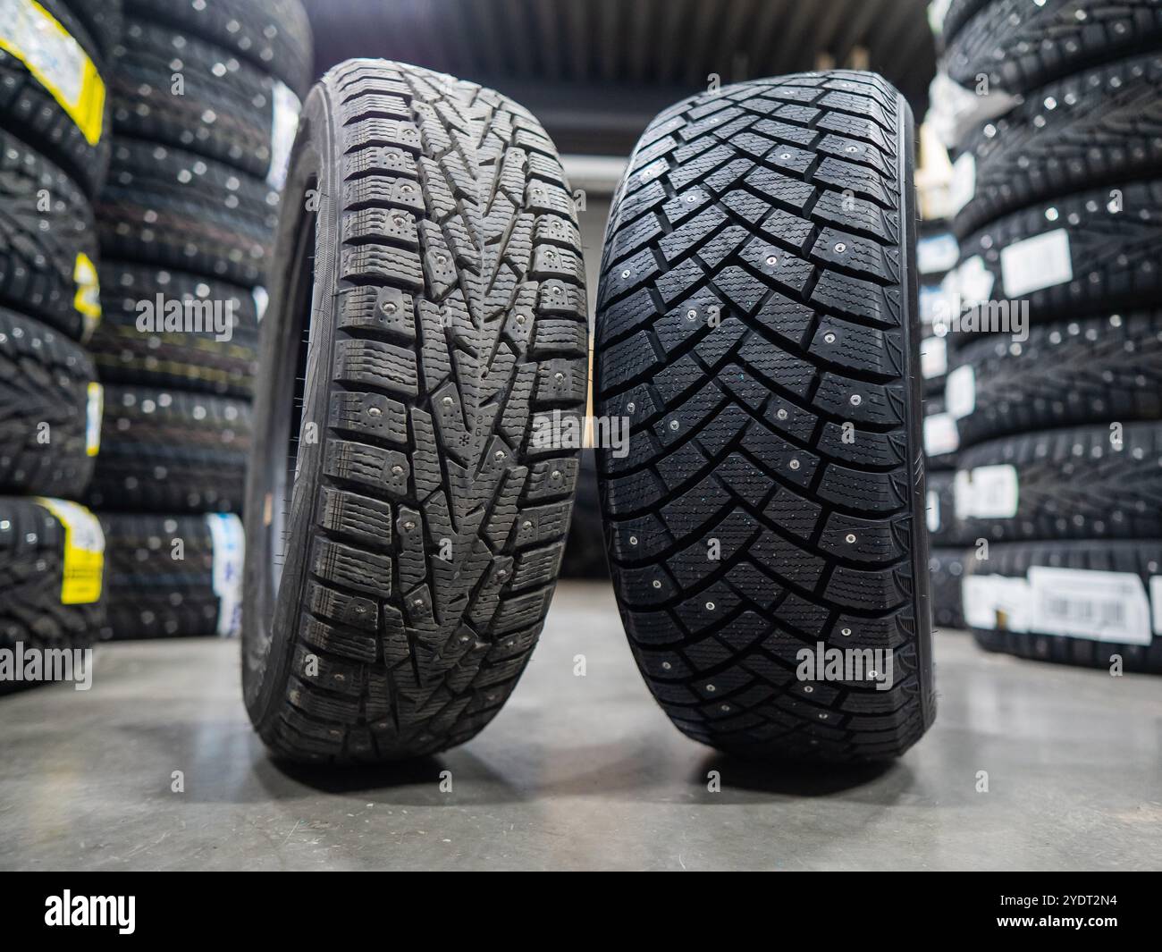 Comparison of old and new studded car tires Stock Photo - Alamy