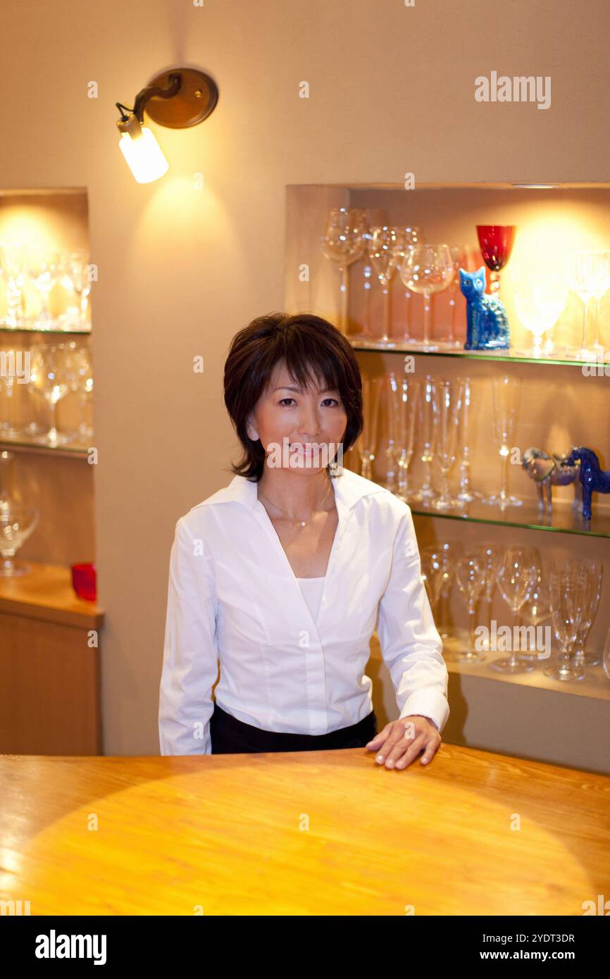 Owner of BAR standing at counter Stock Photo - Alamy