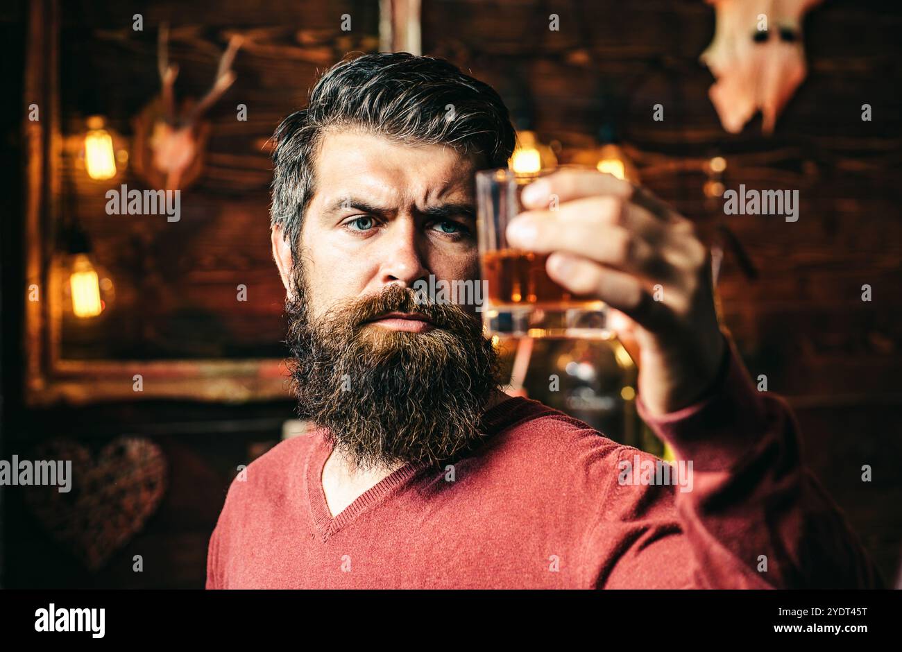 Alcoholic with bottle and glass drinking whiskey at night. Retro bar ...
