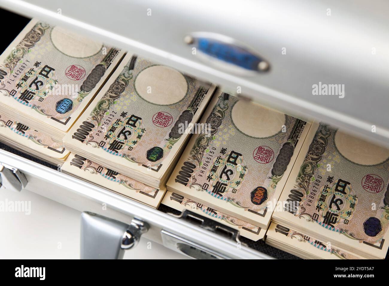 Attache case and wad of notes Stock Photo - Alamy