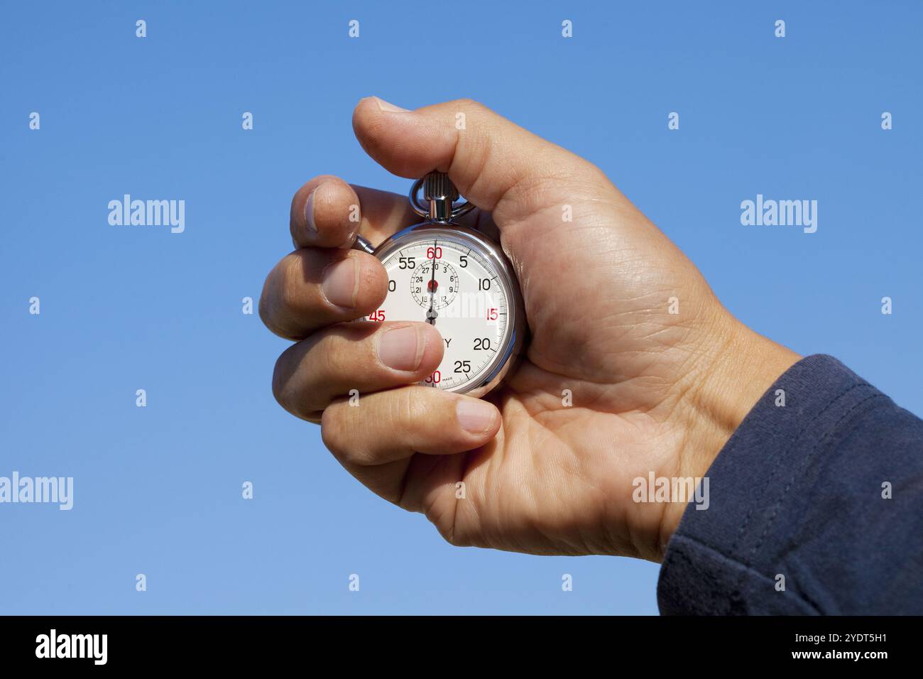 Hand holding stopwatch Stock Photo - Alamy