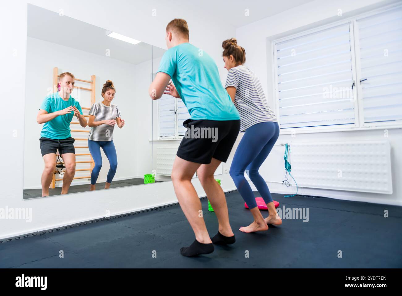 Woman with ankle pain in physical therapy. Physical therapist ...