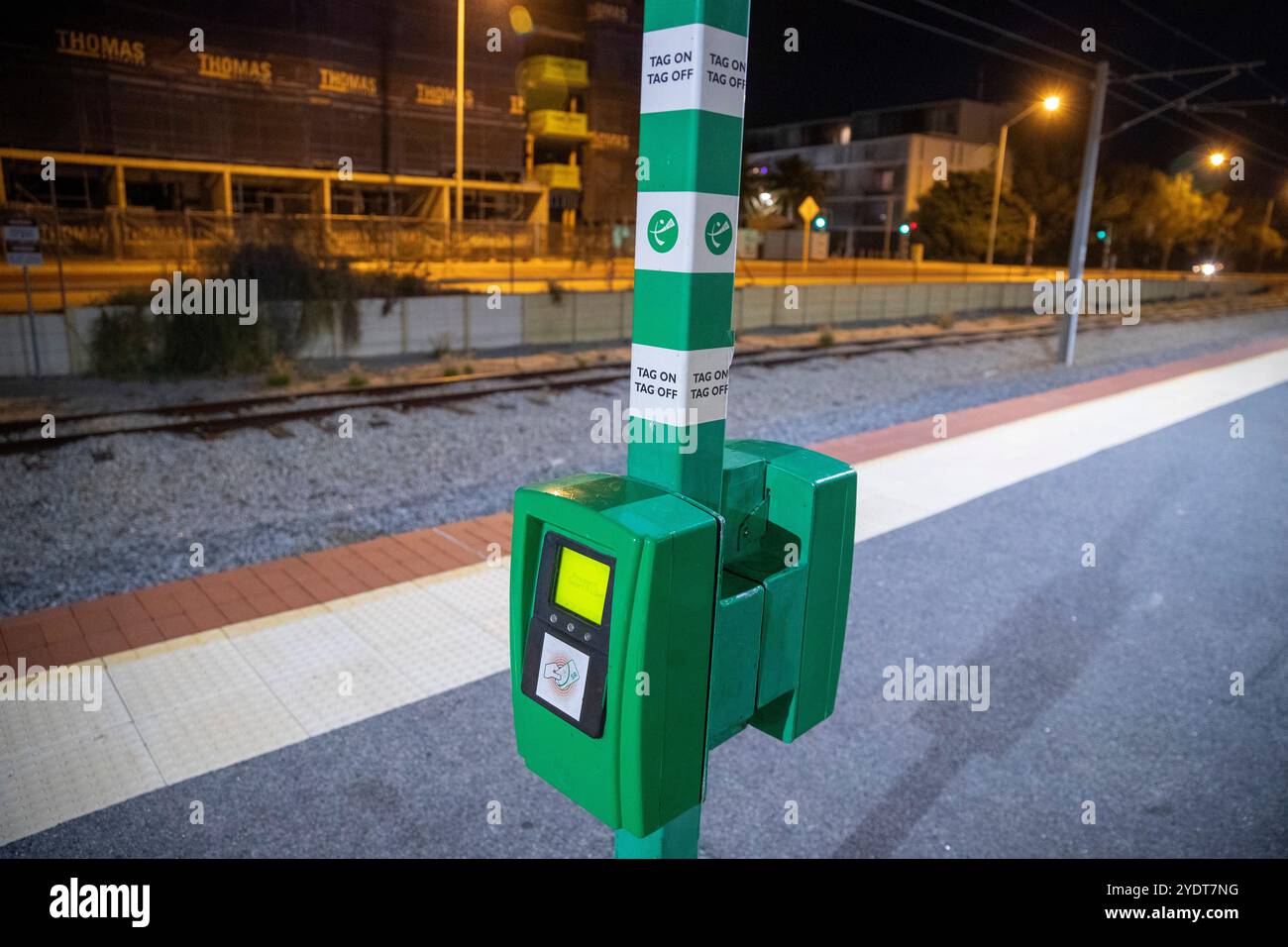 This image shows a public transit ticket validation machine at a train ...