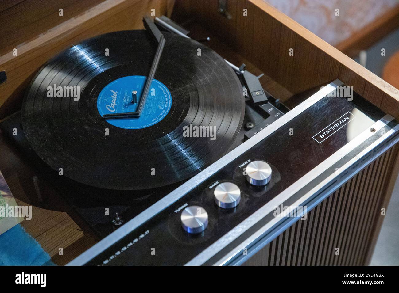 A close-up of a vintage record player with a vinyl record labeled ...