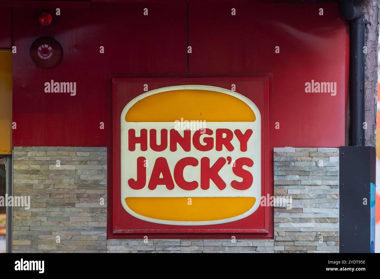 The sign of "Hungry Jack's" restaurant displayed prominently on a deep ...