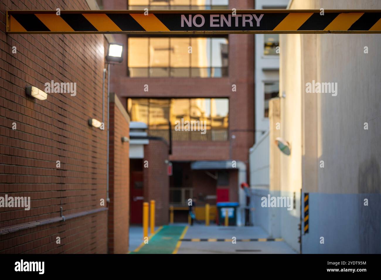 This image captures a restrictive "NO ENTRY" sign placed over an ...