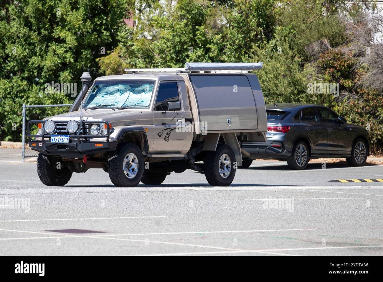 A rugged utility vehicle, equipped with an off-road front bumper and ...
