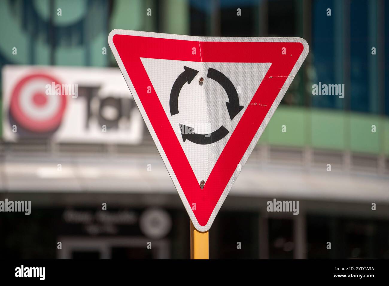 A roundabout traffic sign in Perth, Australia, featuring a red ...