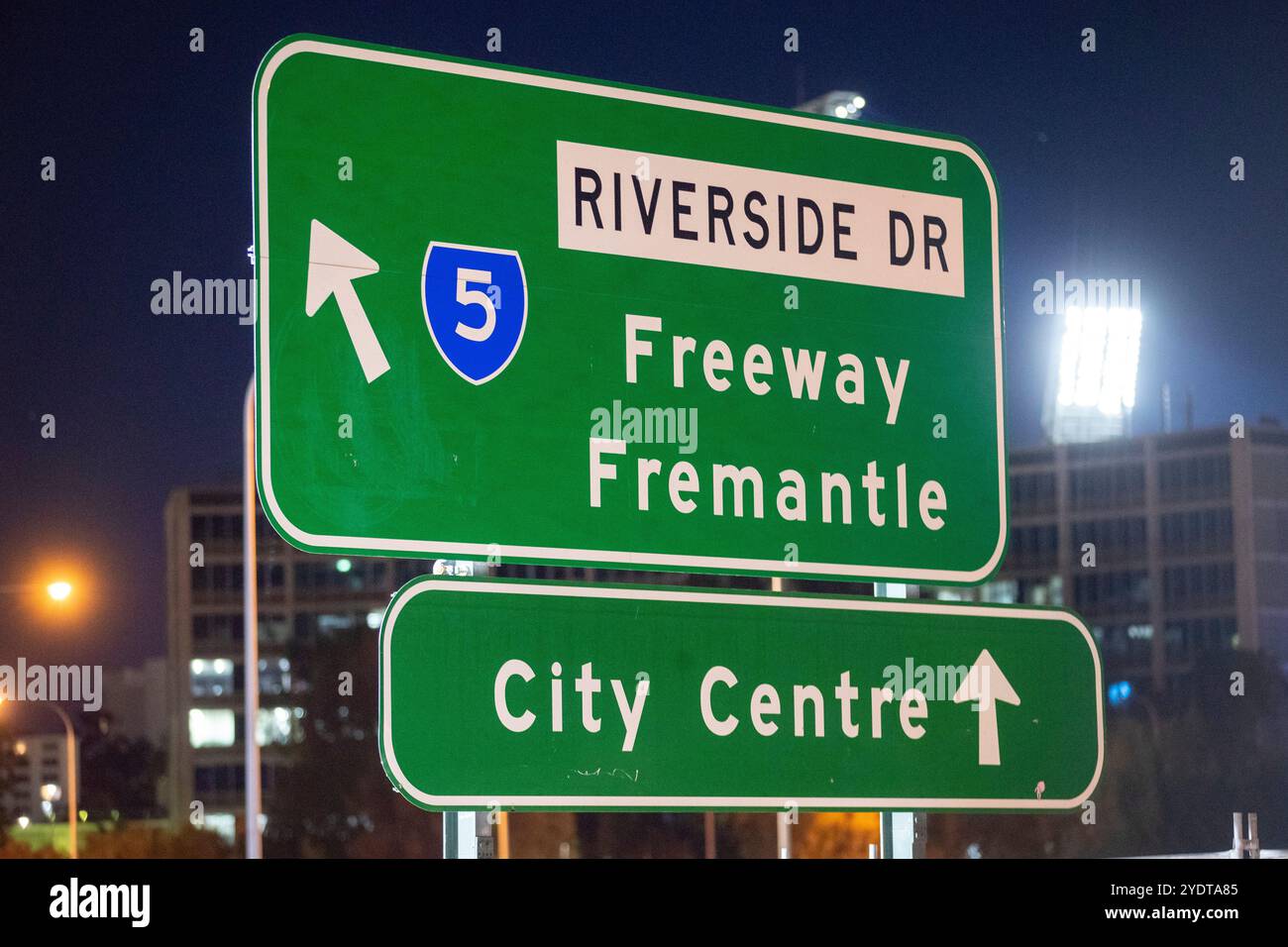 A green highway sign in Perth, Australia, directing traffic towards ...
