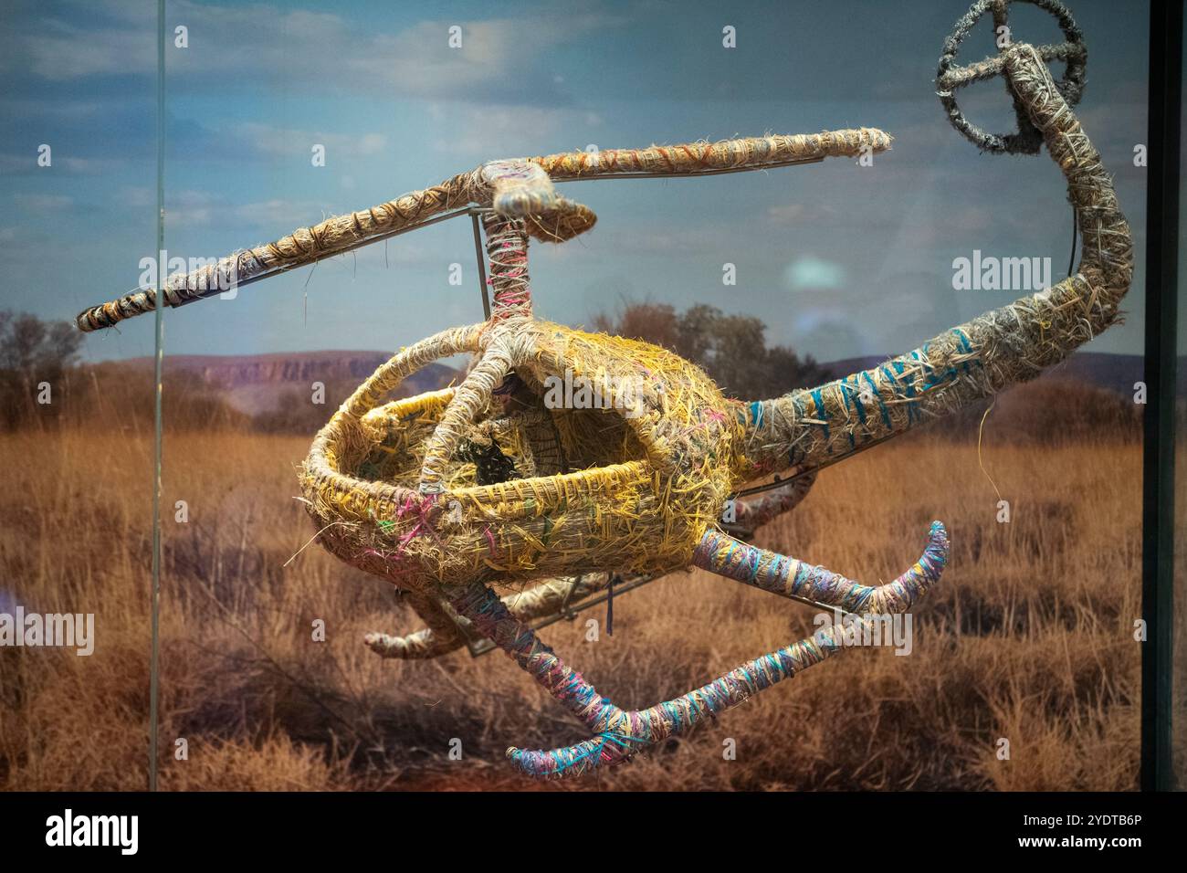 This image shows a helicopter model crafted from woven and bound ...