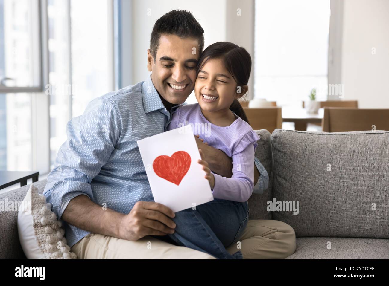 Indian man giving gift daughter hi-res stock photography and images - Alamy