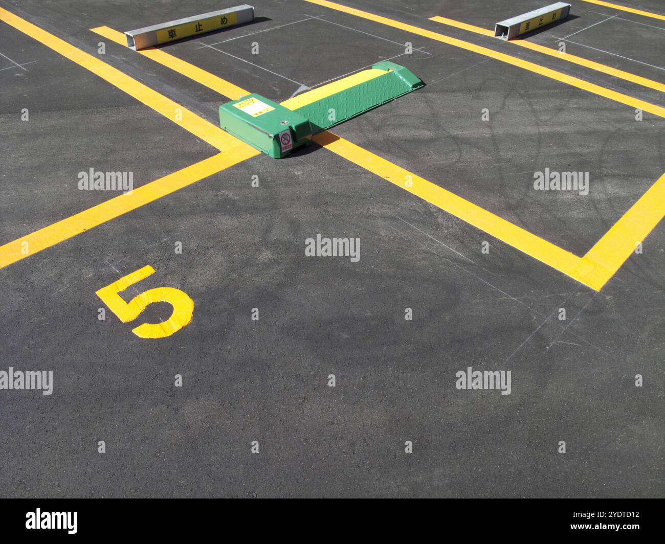 Coin-operated parking stopper Stock Photo - Alamy