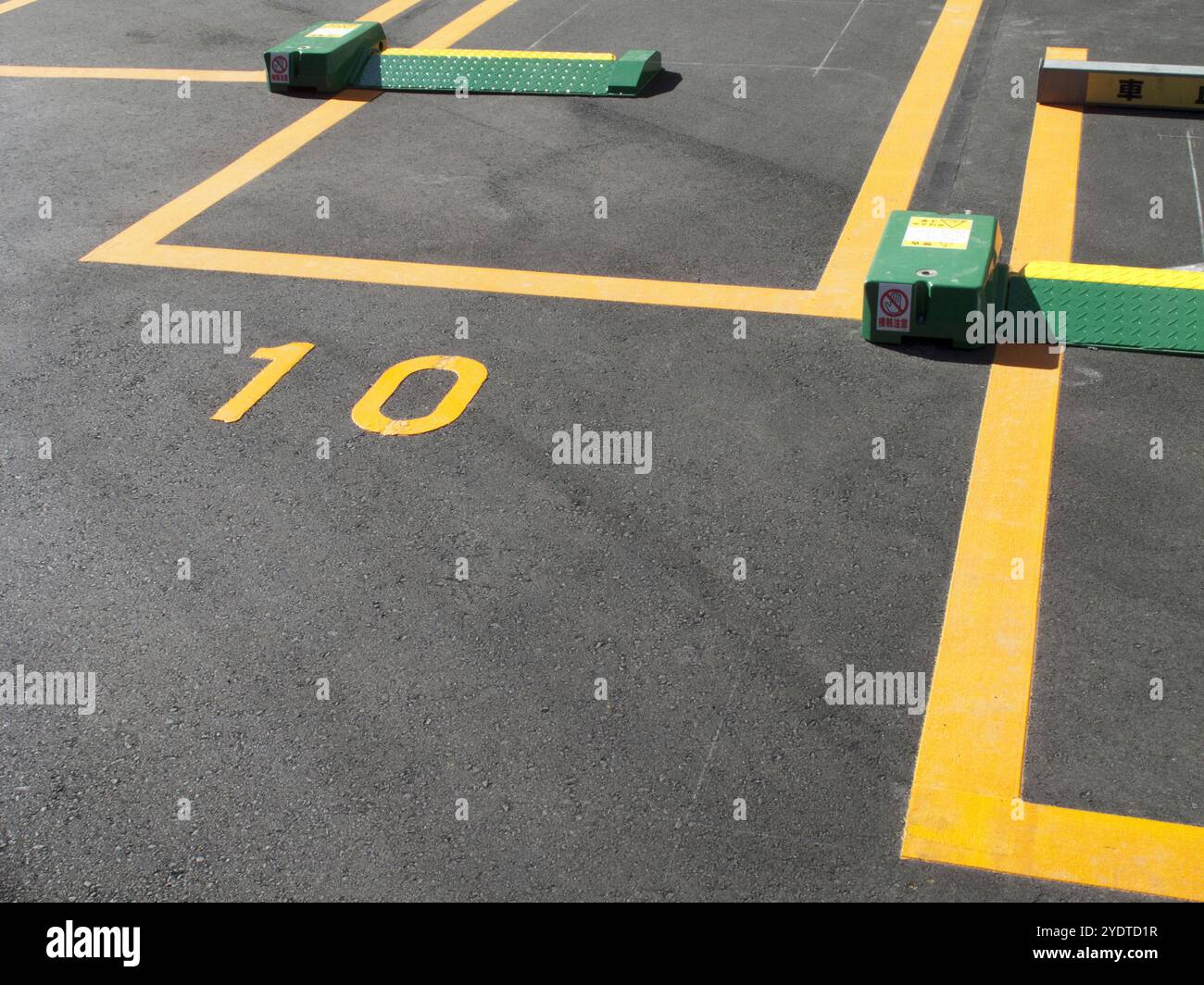Coin-operated parking stopper Stock Photo - Alamy