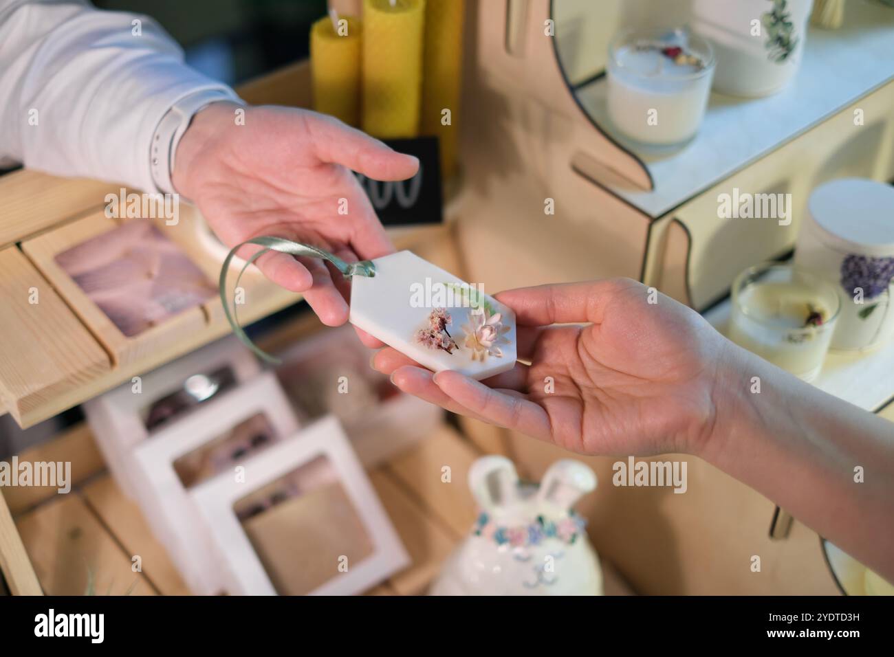 Handmade Aromatic Sachet Sale: A woman at a market hands over artisanal ...