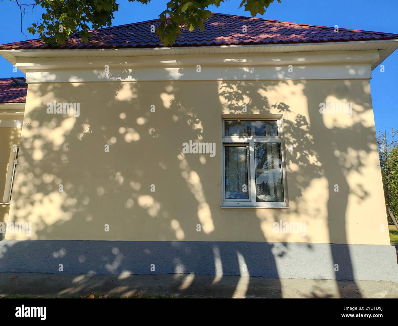 A vintage building with distinctive red brick columns and a spacious ...