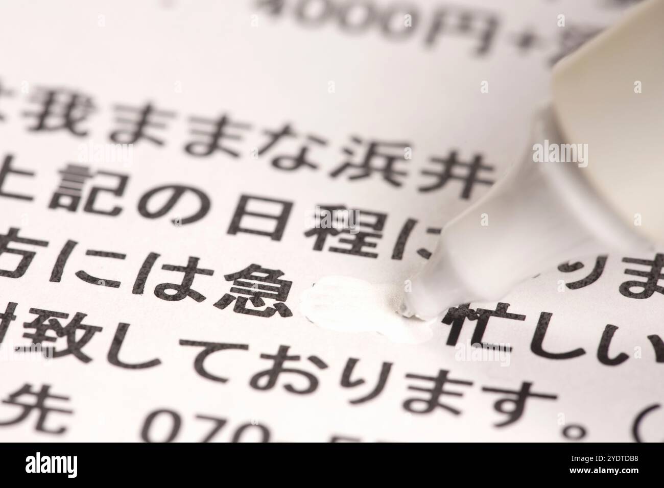 Correcting letters with correction fluid Stock Photo - Alamy